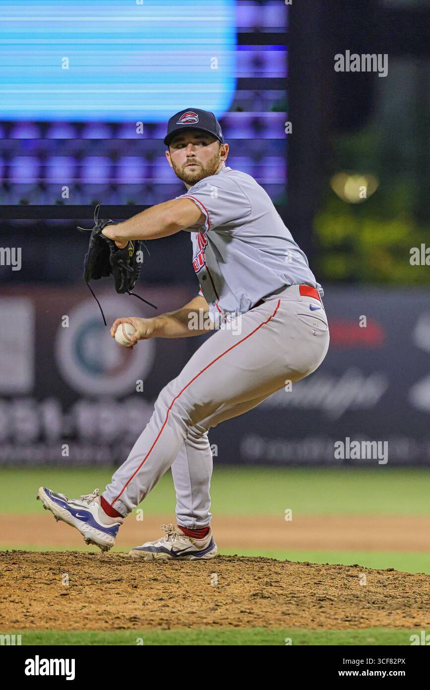 Greensboro, NC: Greenville Drive pitcher Jonathan Brand (12) warms up ...