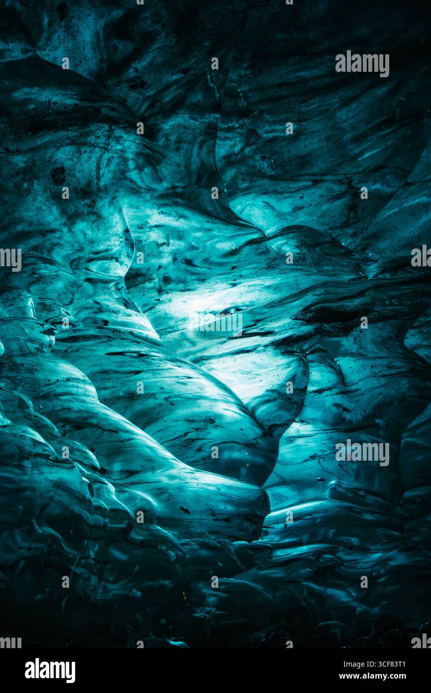 Stunning blue ice cave formations inside a glacier in Iceland, showing ...