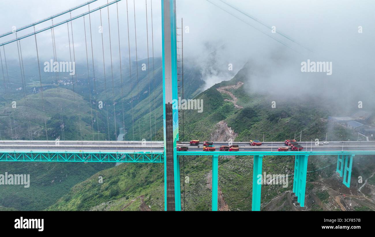 QIANXINAN, CHINA - AUGUST 21, 2025 - Trucks were driven in batches onto ...