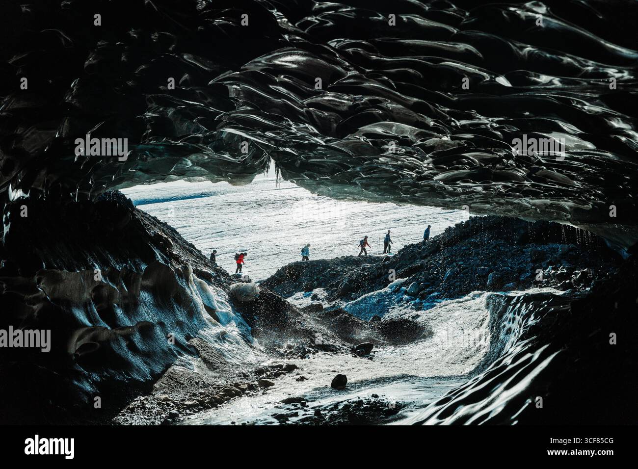 Stunning blue ice cave formations inside a glacier in Iceland, showing ...