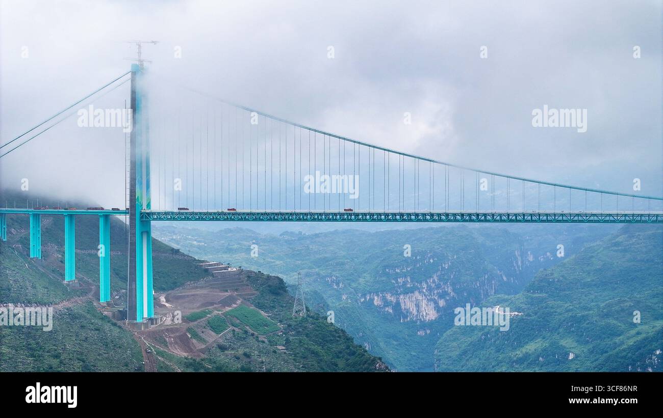 QIANXINAN, CHINA - AUGUST 21, 2025 - Trucks were driven in batches onto ...