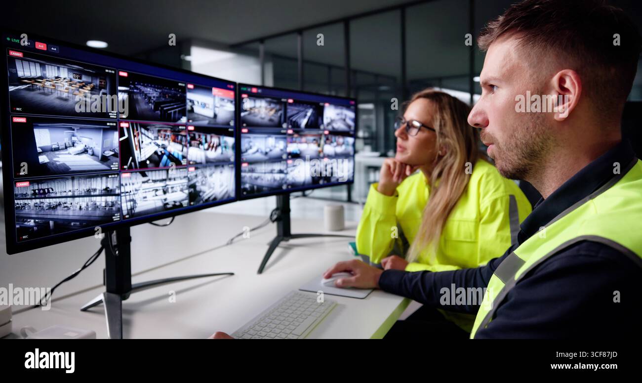 Corporate Surveillance Operator Examines CCTV Security Camera Control ...