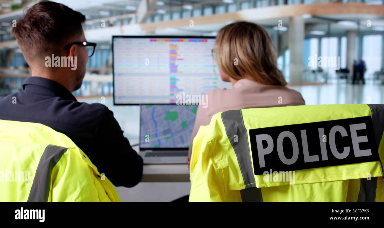 Caucasian Police Officer Monitoring Criminal Records On Modern Computer ...