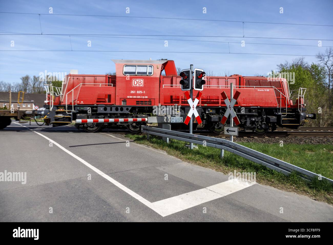 Passing goods train with locomotive Gravitation 10 BB at level crossing ...