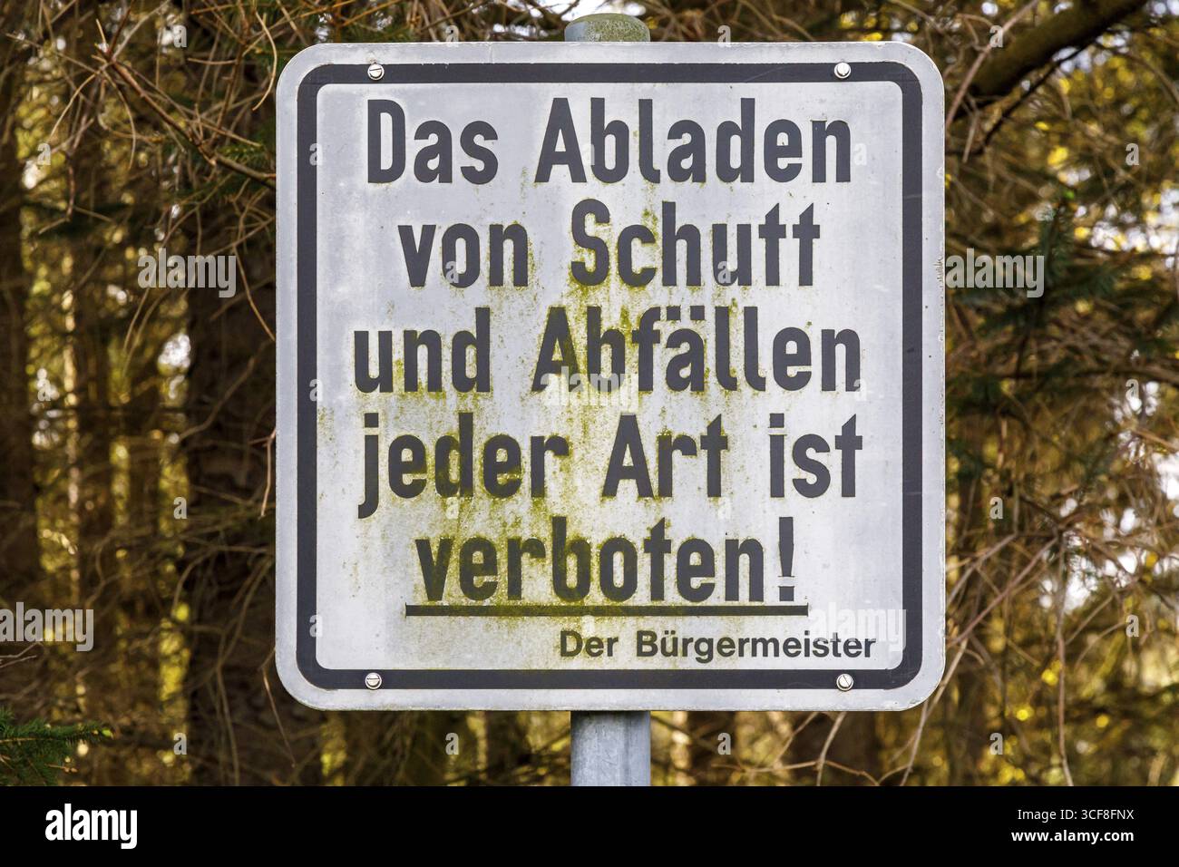 Prohibition sign on the forest path: Dumping of debris and waste of any ...
