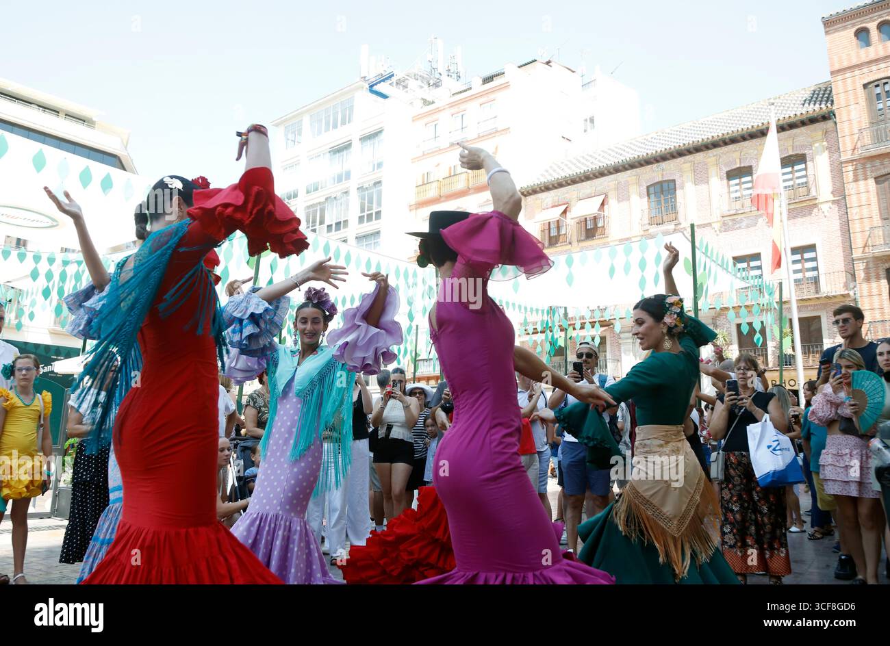 Women dressed in traditional costume, dance and enjoy the fair in the ...