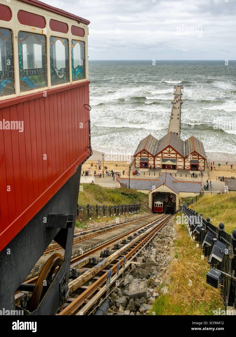 A carriage of the Saltburn Cliff Tramway ascends the track, with the ...