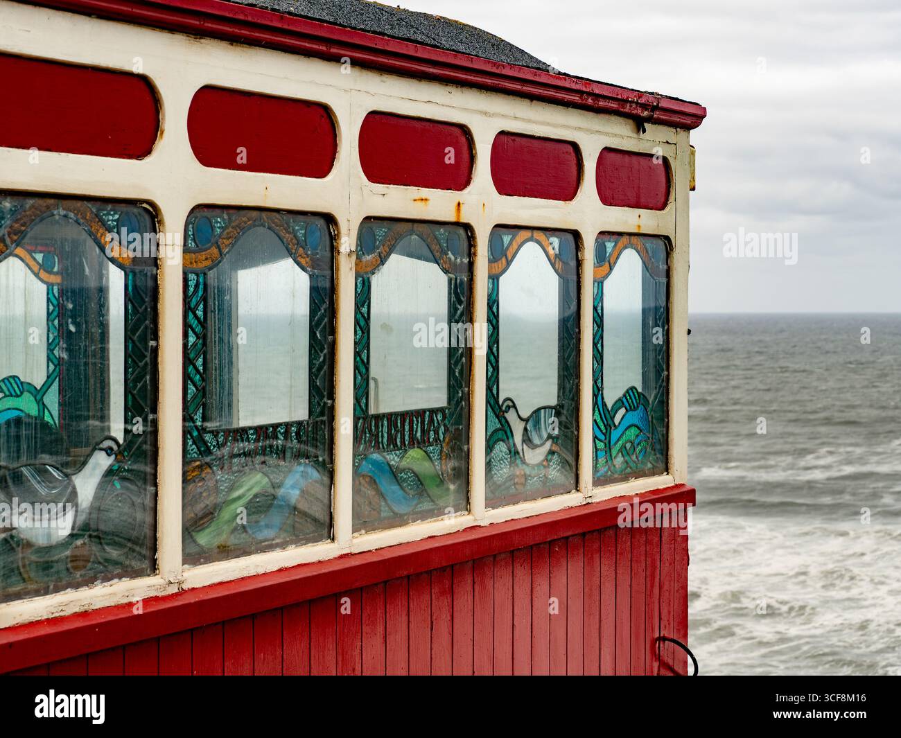 Detail of the beautiful stained glass windows, depicting seabirds, in a ...