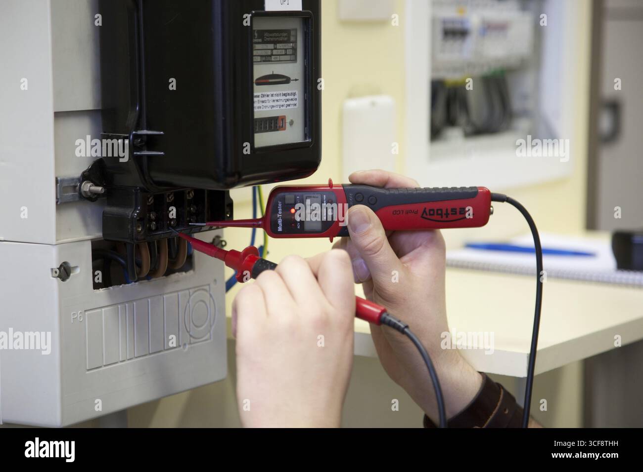 Voltage tester, voltage measurement on a meter Stock Photo - Alamy