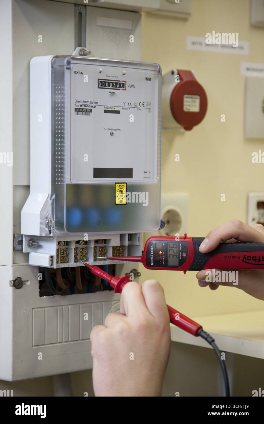 Voltage tester, voltage measurement on a meter Stock Photo - Alamy