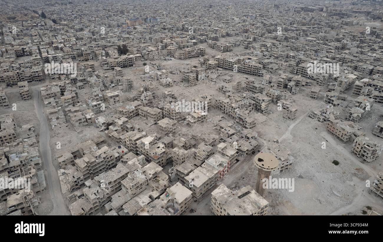 An aerial drone view shows massive destruction of buildings caused by ...