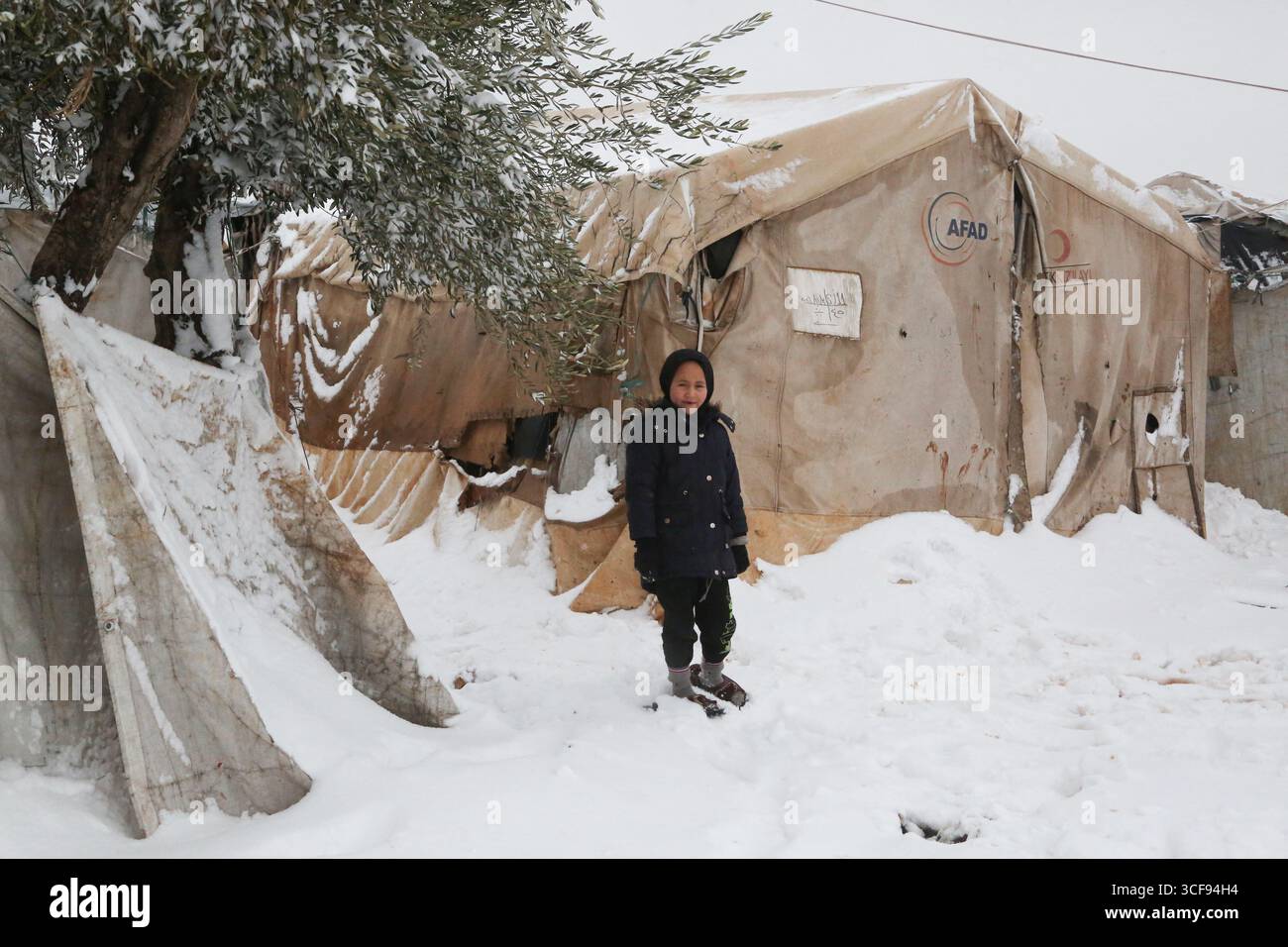Displaced Syrian families and children living in refugee camps during ...