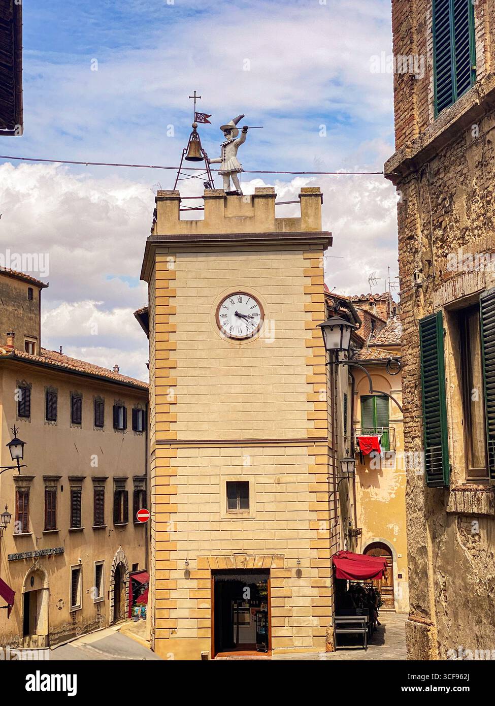 Clock tower featuring animated bell ringer standing prominently in ...