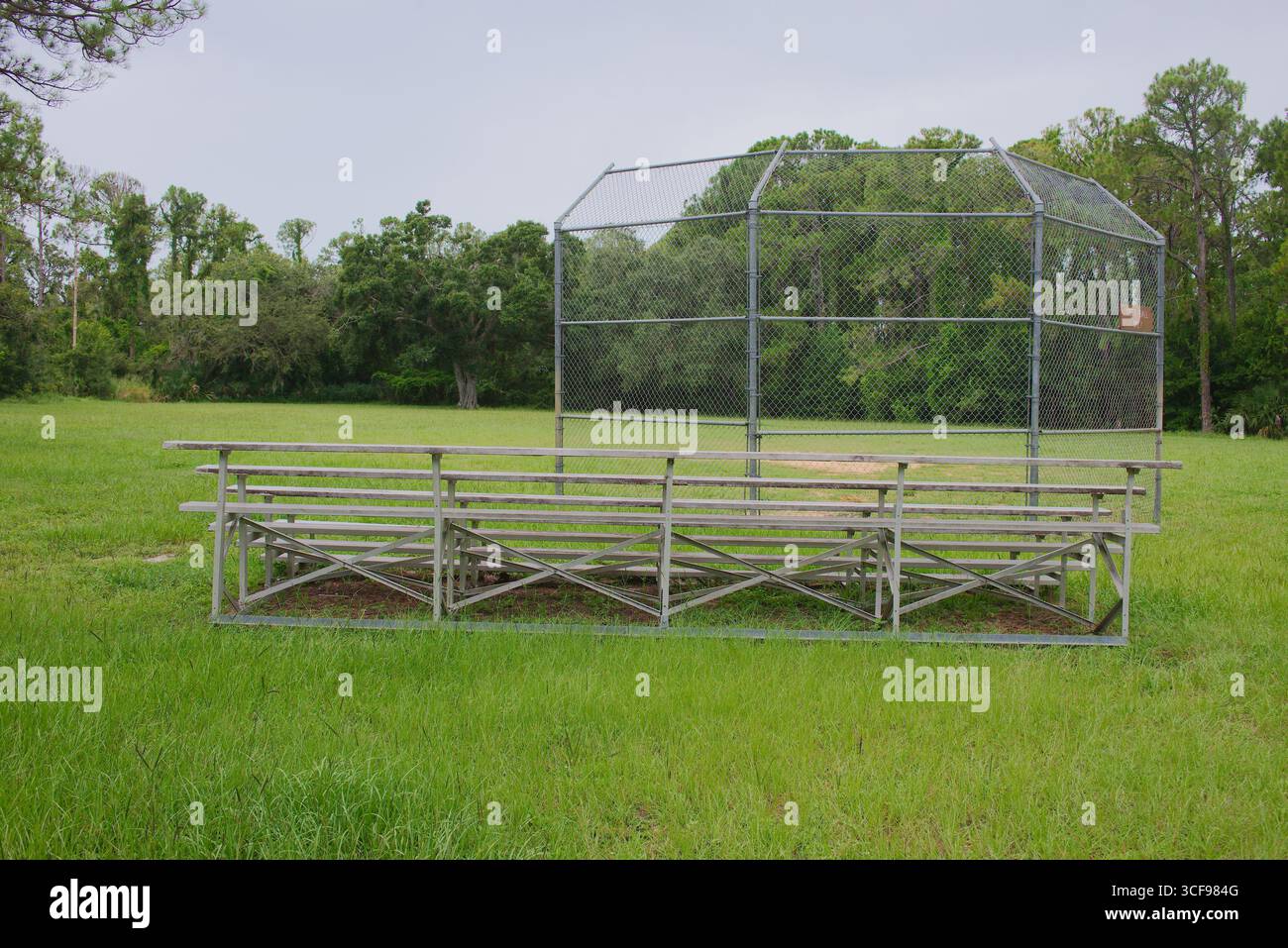 Empty Baseball Field With Bleachers Surrounded by Lush Green Grass and ...