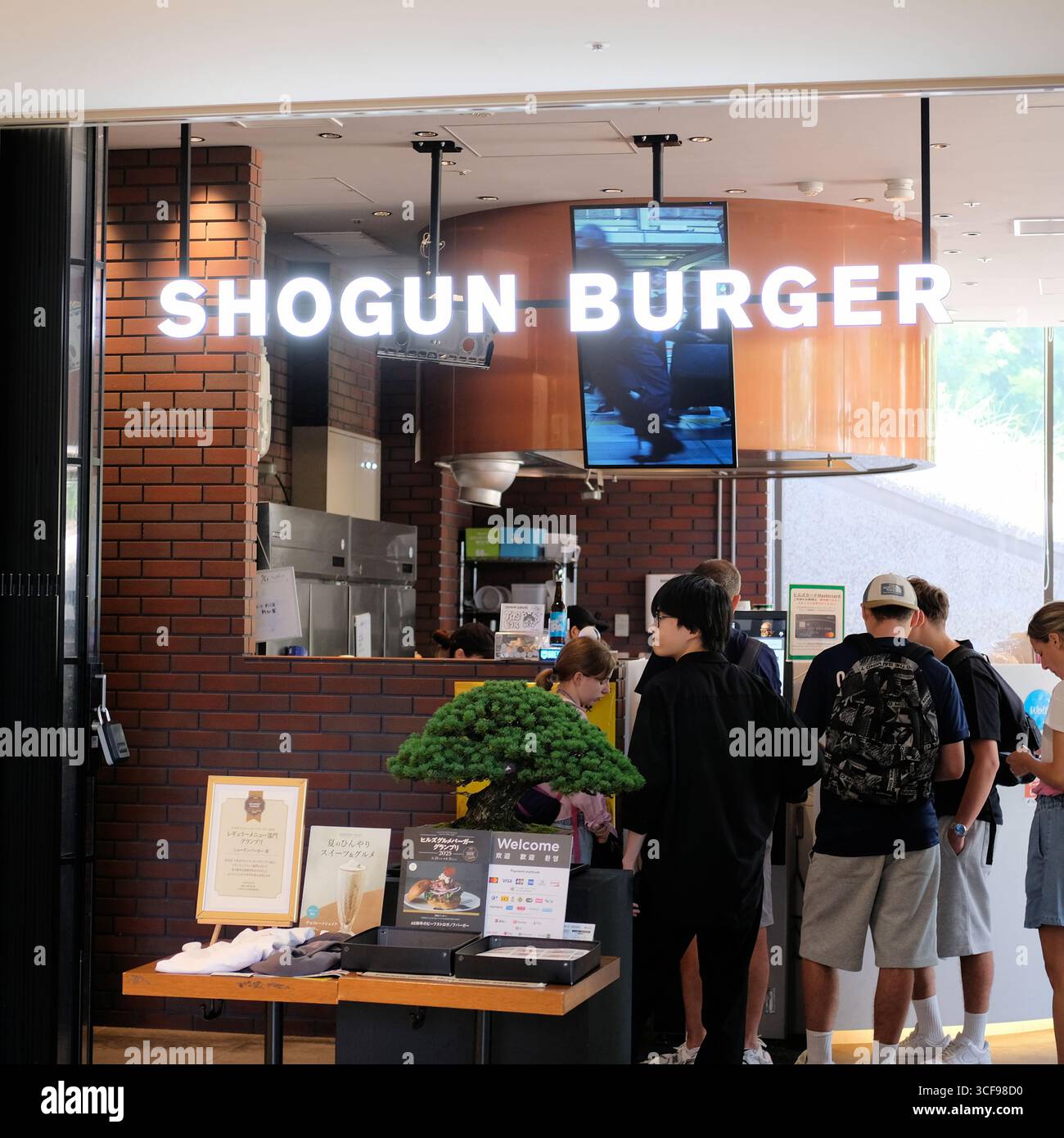 Customers at Shogun Burger fast food restaurant at Azabudai Hills Tower ...
