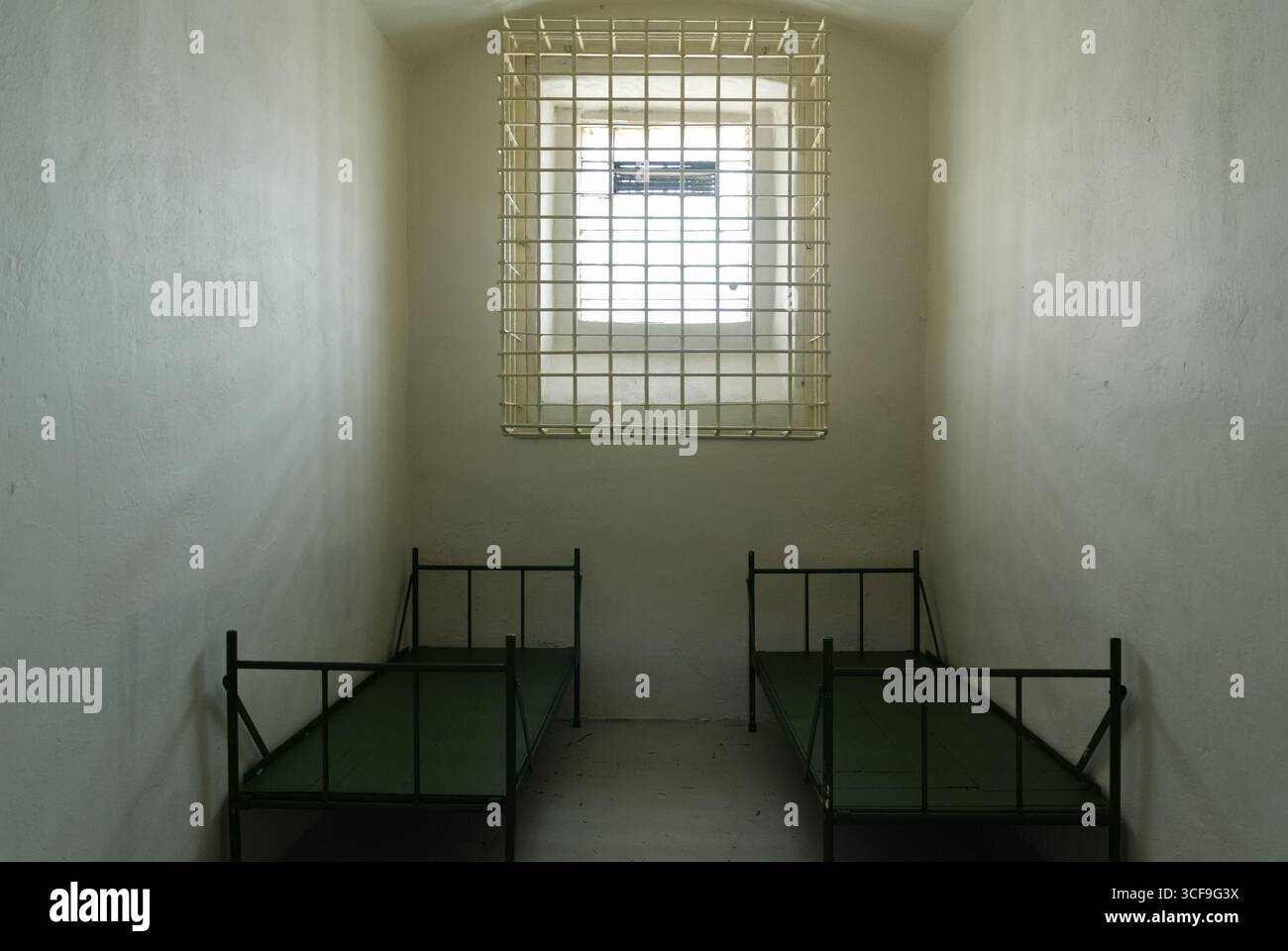 Prison cell with two beds used in communist Czechoslovakia Stock Photo ...