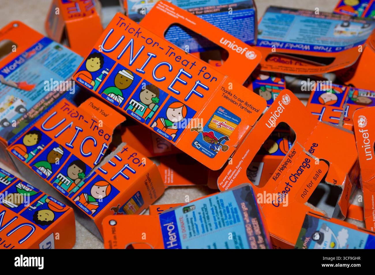 Pile of empty UNICEF Trick-or-Treat donation boxes Stock Photo - Alamy