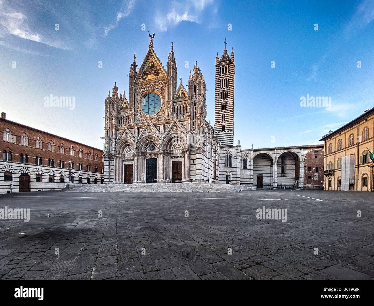 Marble-clad Siena Cathedral dominating historic Piazza del Duomo ...