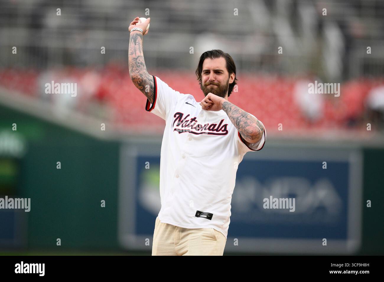 Washington Capitals hockey player Logan Thompson throws out the ...