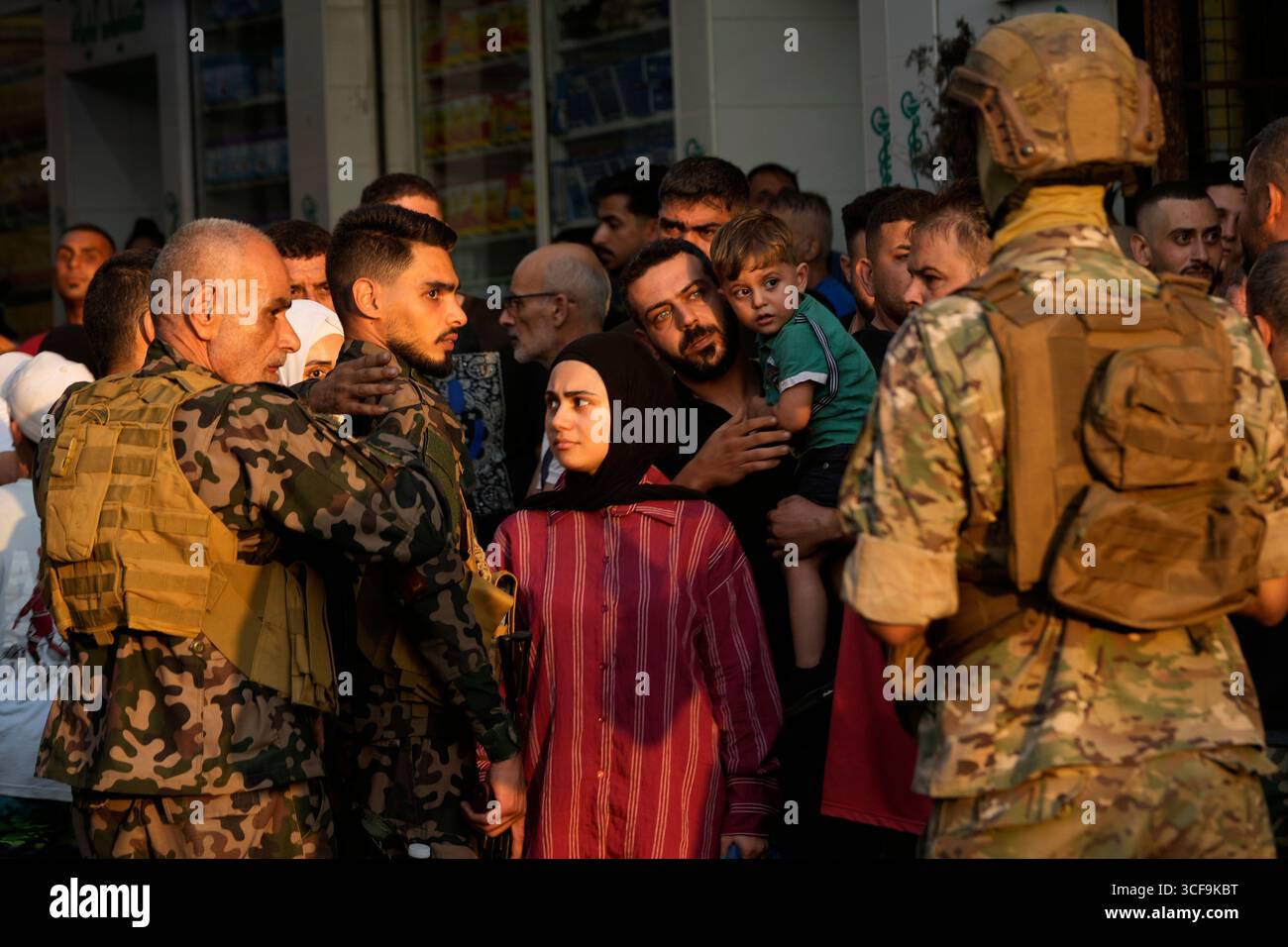 Palestinian gunmen from the National Security Forces, left, and ...