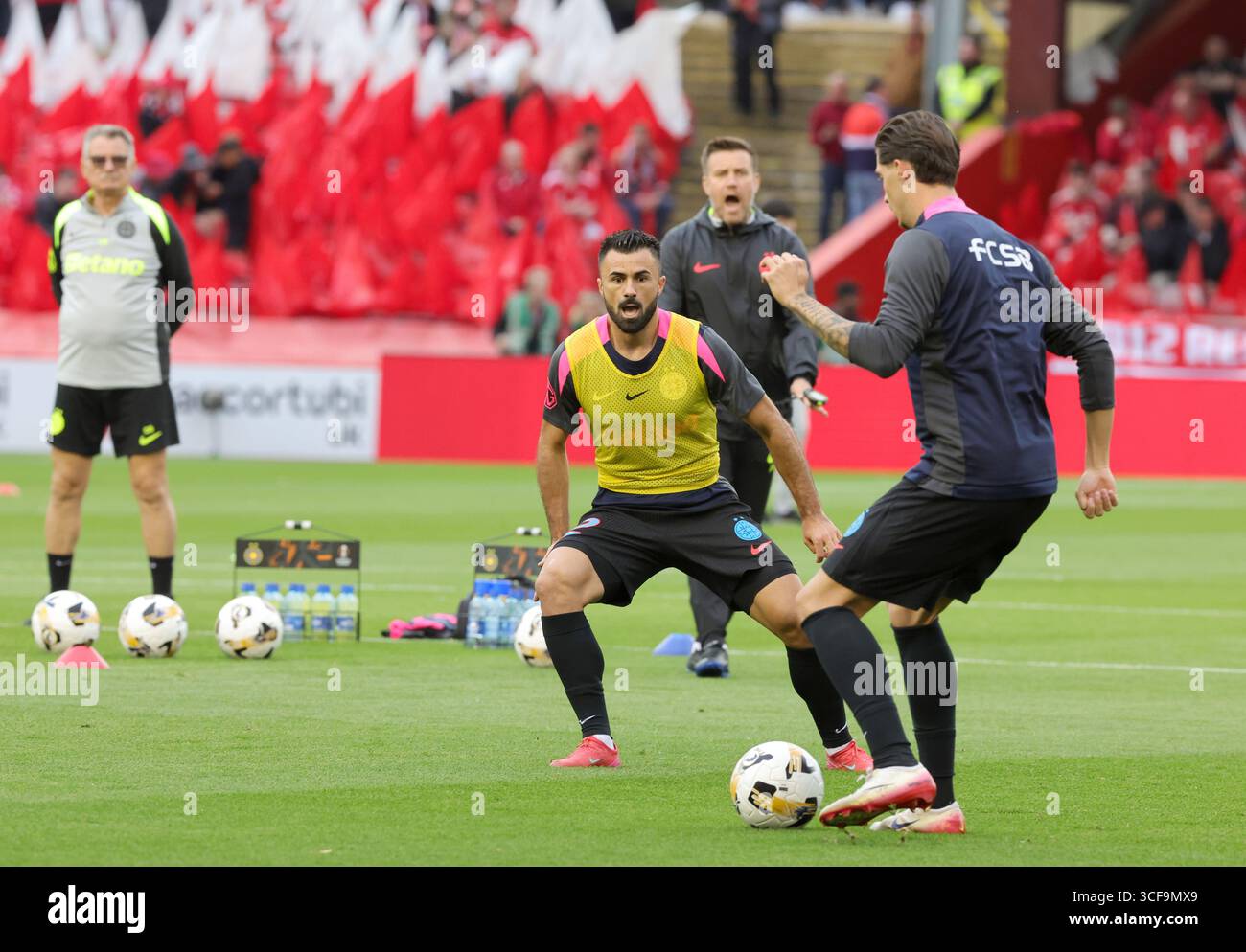 FCSB players warm up before the UEFA Europa League play-off match at ...