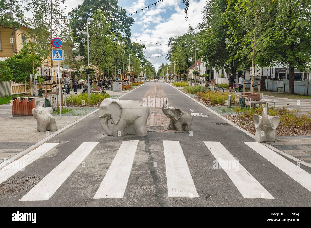 Pedestrian and cycle path featuring elephant sculptures. The street is ...