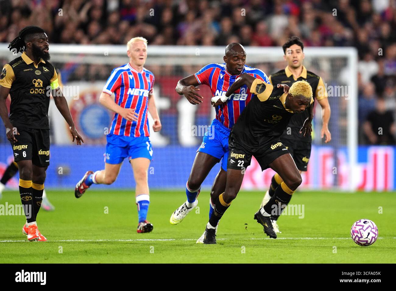 Crystal Palace's Jean-Philippe Mateta and Fredrikstad's Maxwell Woledzi battle for the ball ...