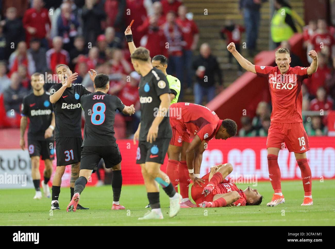 FCSB Juri Cisotti fouls Aberdeen's Nicolas Milanovic to receive a red ...
