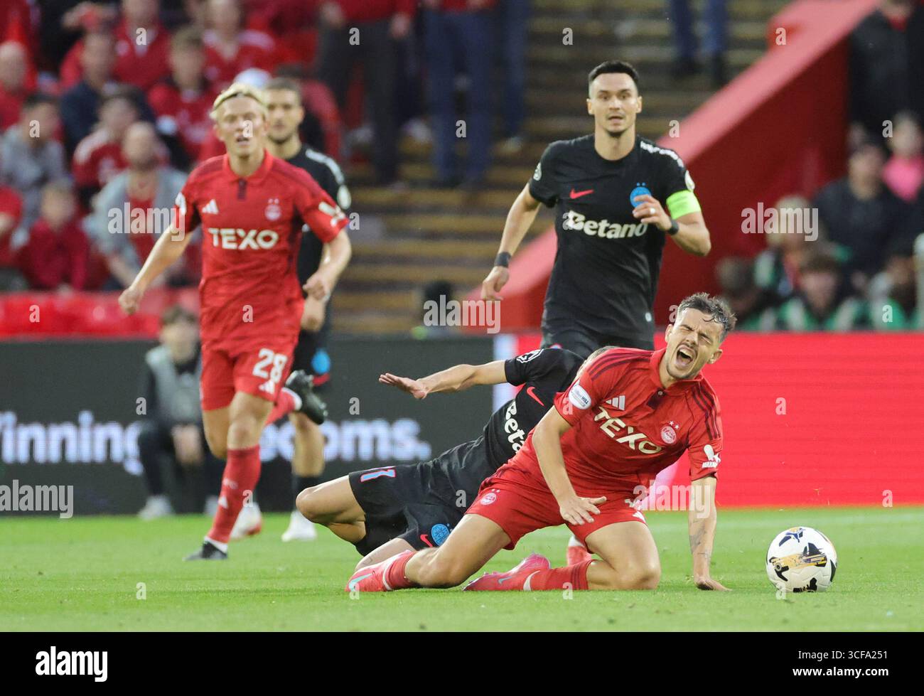FCSB Juri Cisotti fouls Aberdeen's Nicolas Milanovic during the UEFA ...