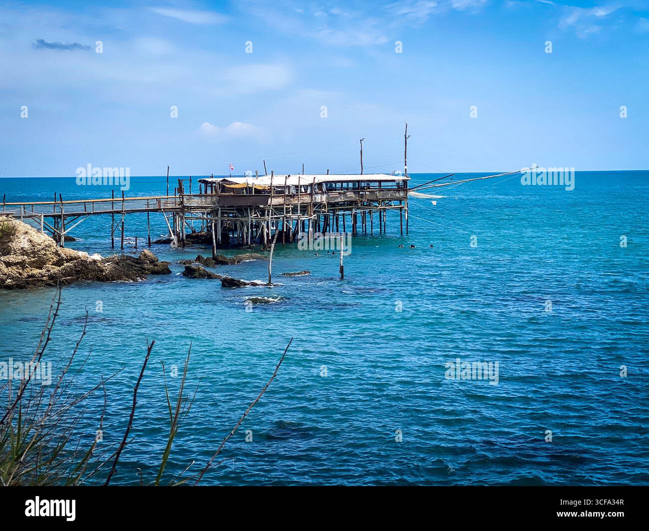Wooden fishing platform supported by wooden stilts, traditional ...