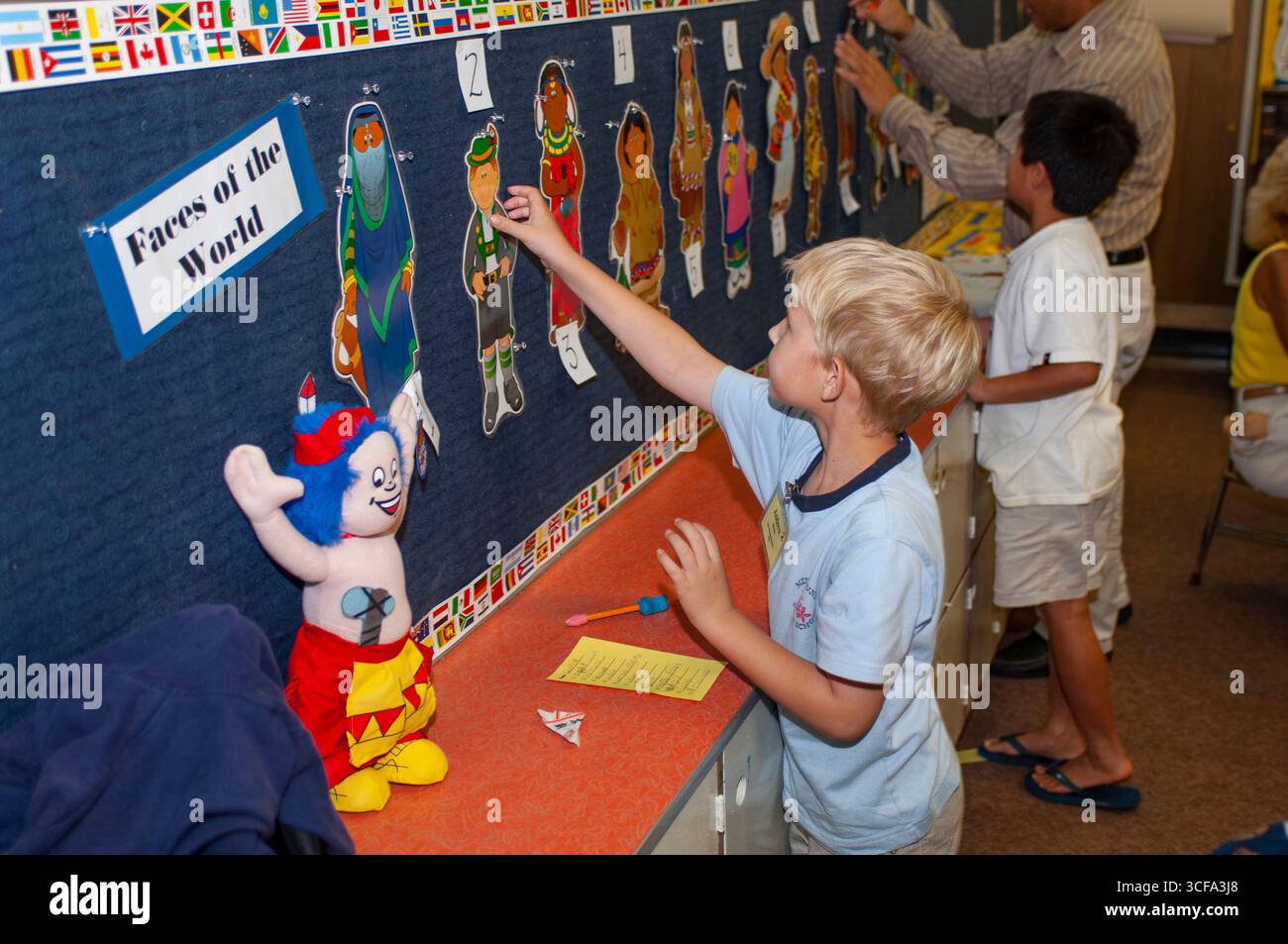 2nd grade boy doing school work by identifying people from different ...