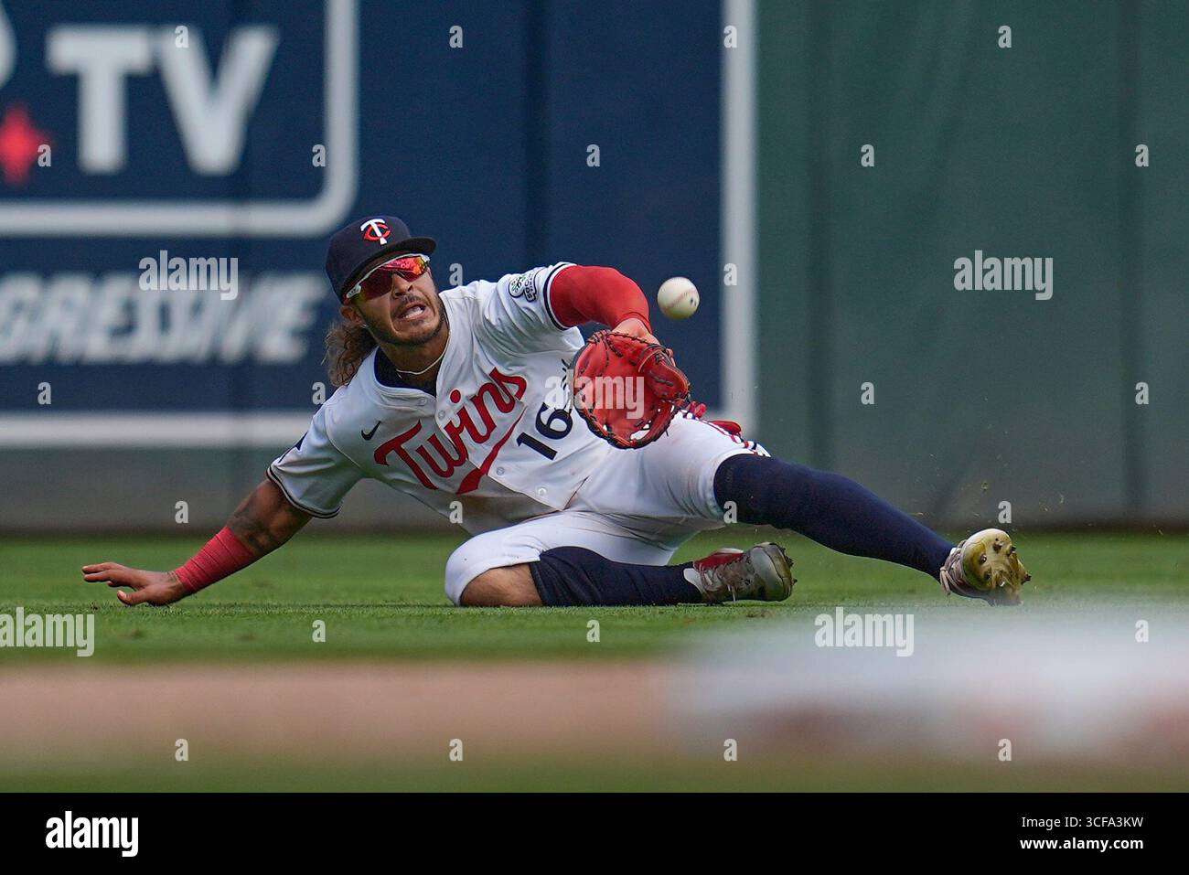 Minnesota Twins left fielder Austin Martin (16) slides to catch a line ...