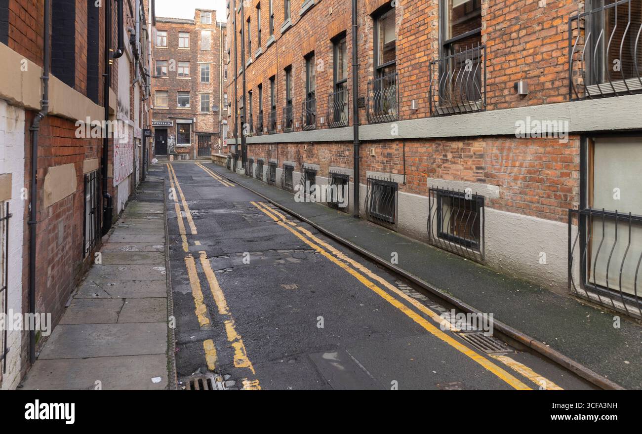 Manchester, uk, January 19th 2025 Narrow Urban Alley with Red Brick ...