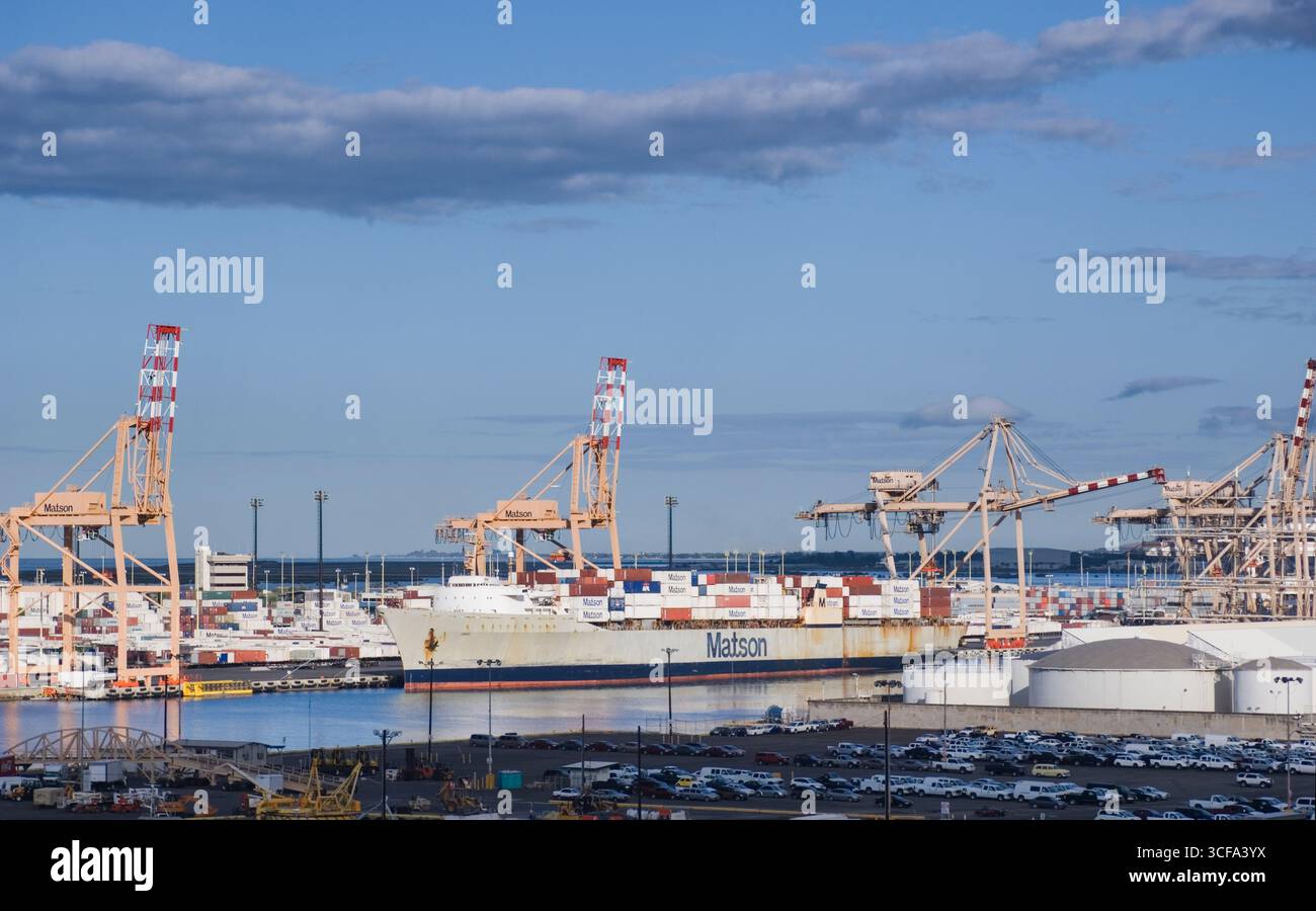 Container ship moored at dock ready for off loading of containers using ...