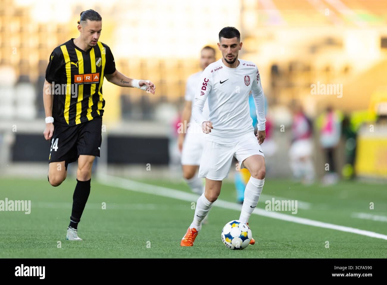 250821 Amor Layouni of Häcken and Meriton Koranic of CFR Cluj during ...