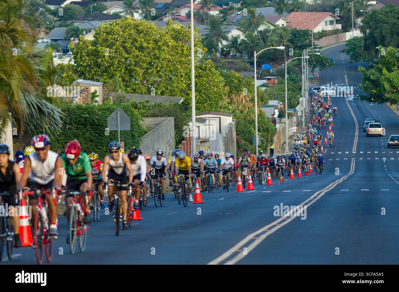 Many bicycle riders climbing the first large hill of the 2005 Honolulu ...