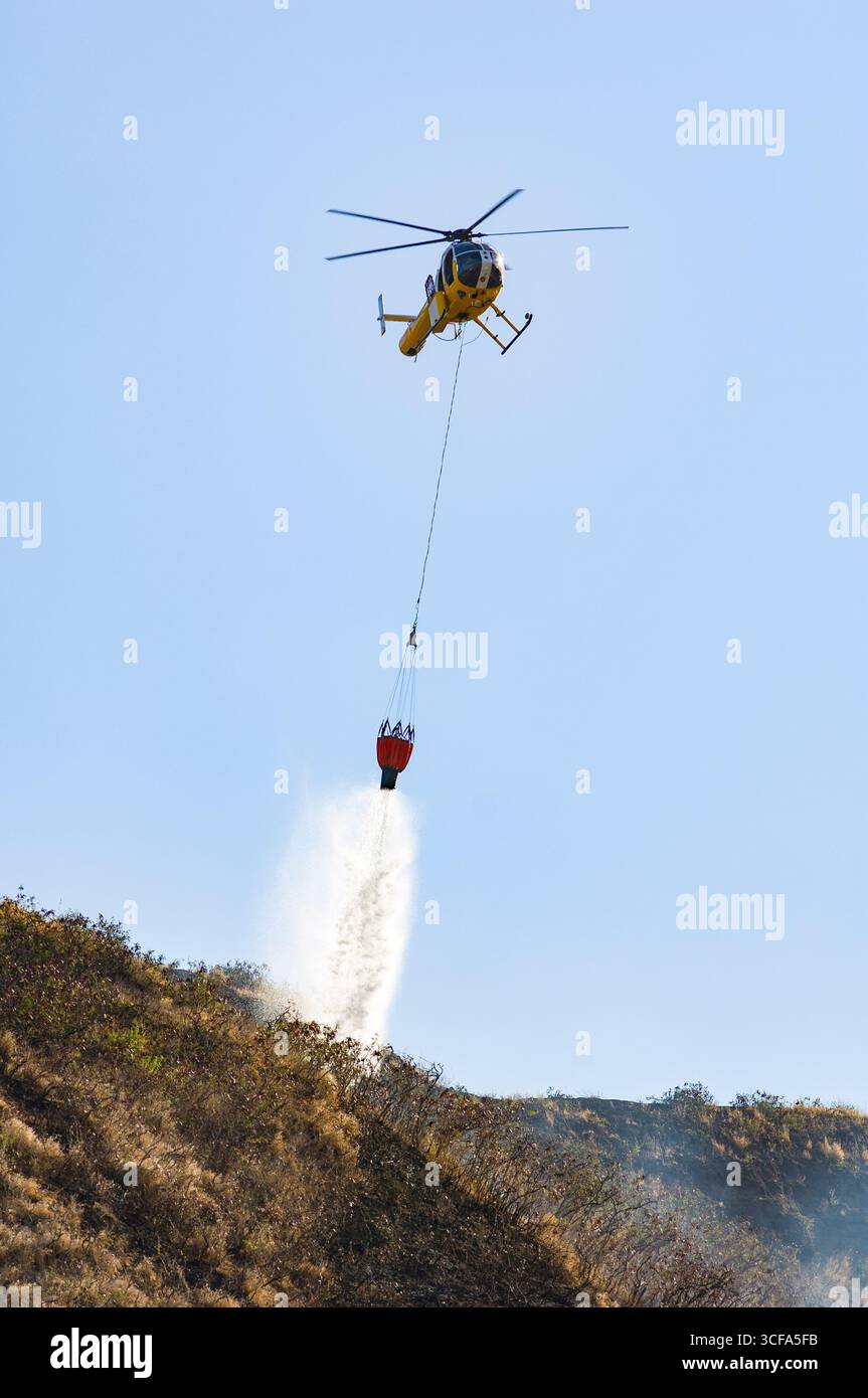 Honolulu Fire Department helicopter MD-520N with long line water bucket ...