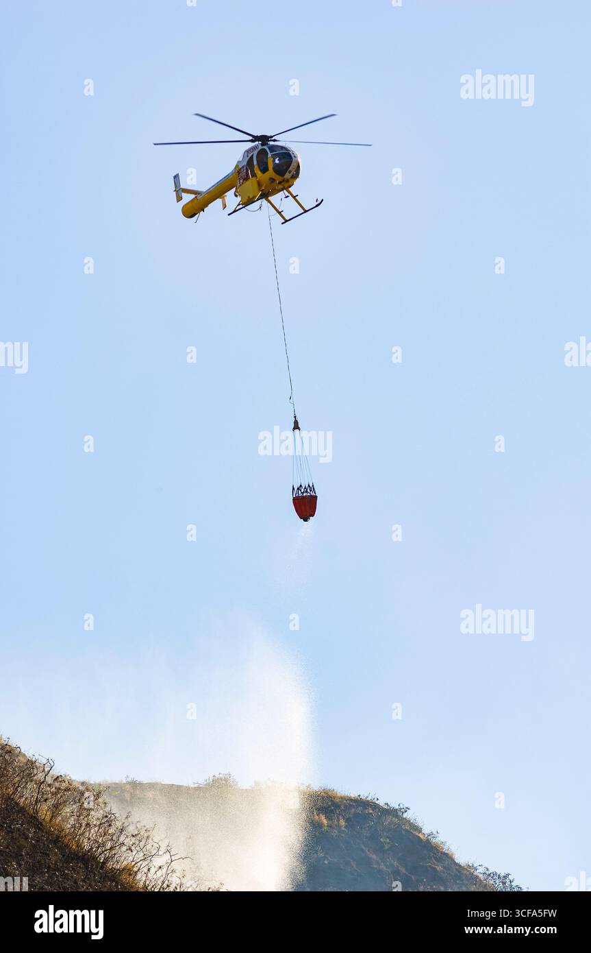 Honolulu Fire Department helicopter MD-520N with long line water bucket ...