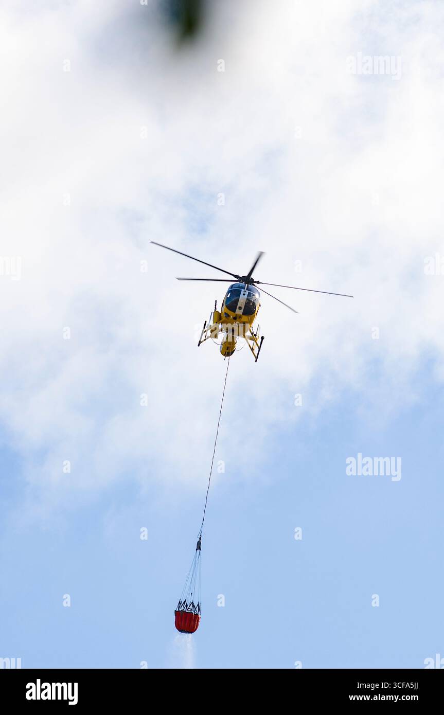 Honolulu Fire Department helicopter MD-520N flying with long line water ...