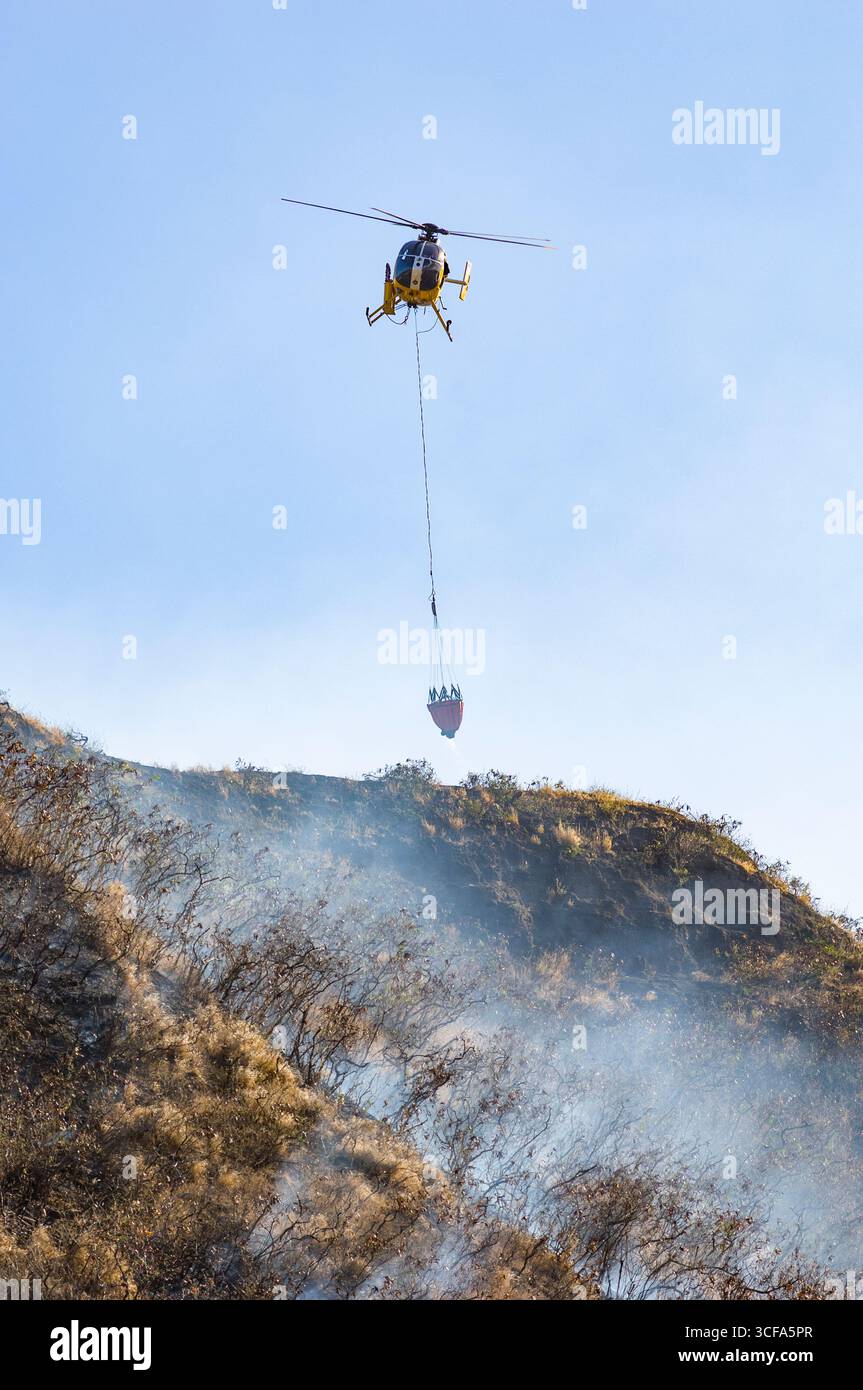 Honolulu Fire Department helicopter MD-520N with long line water bucket ...