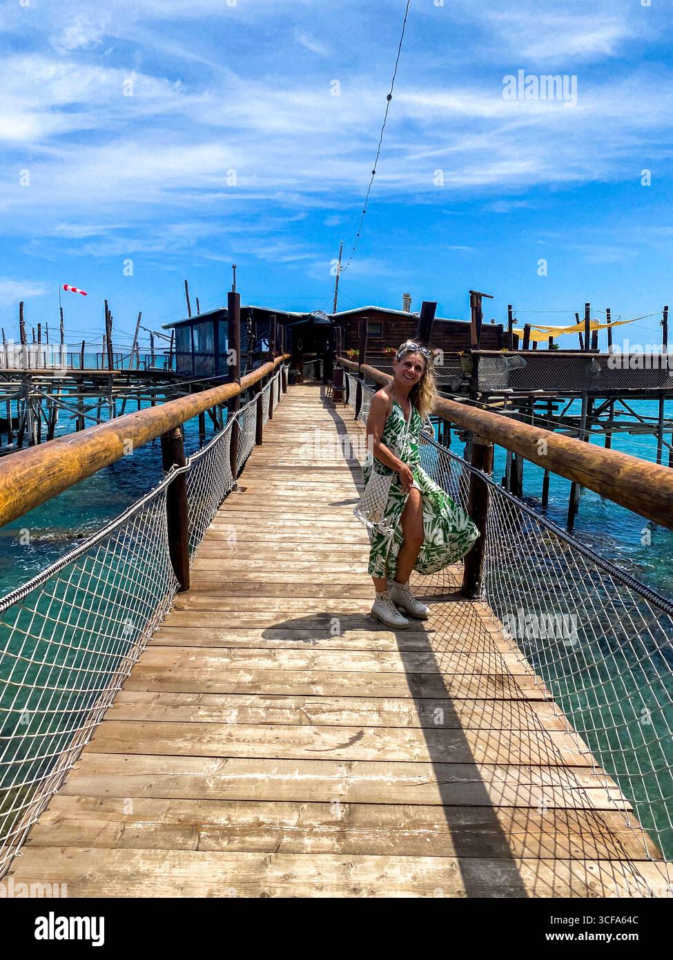 Tourist traversing wooden pier hi-res stock photography and images - Alamy