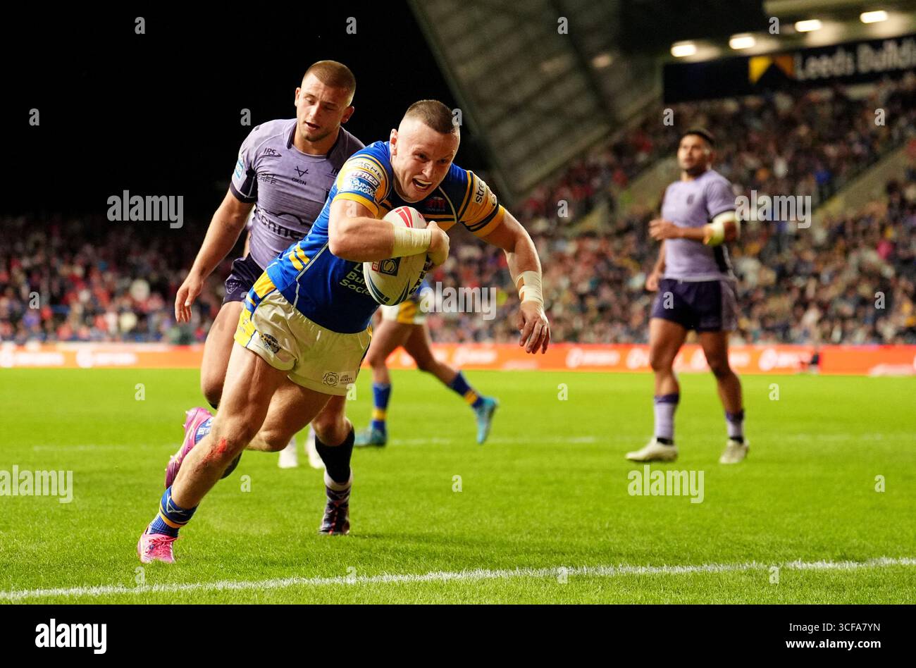 Leeds Rhinos' Harry Newman scores their side's fourth try of the game ...