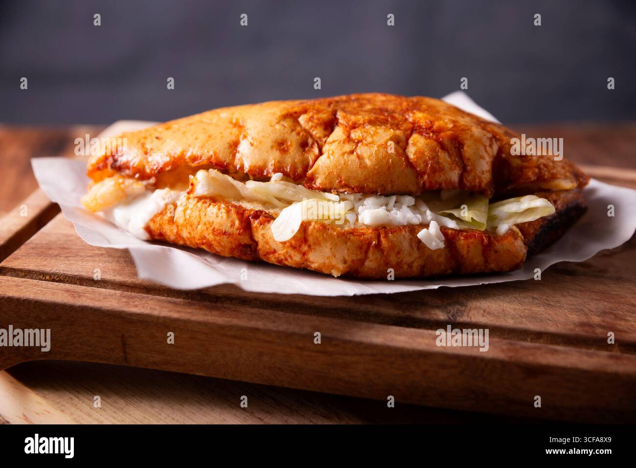 Pambazo. Sandwich marinated in guajillo chili sauce and roasted on a ...