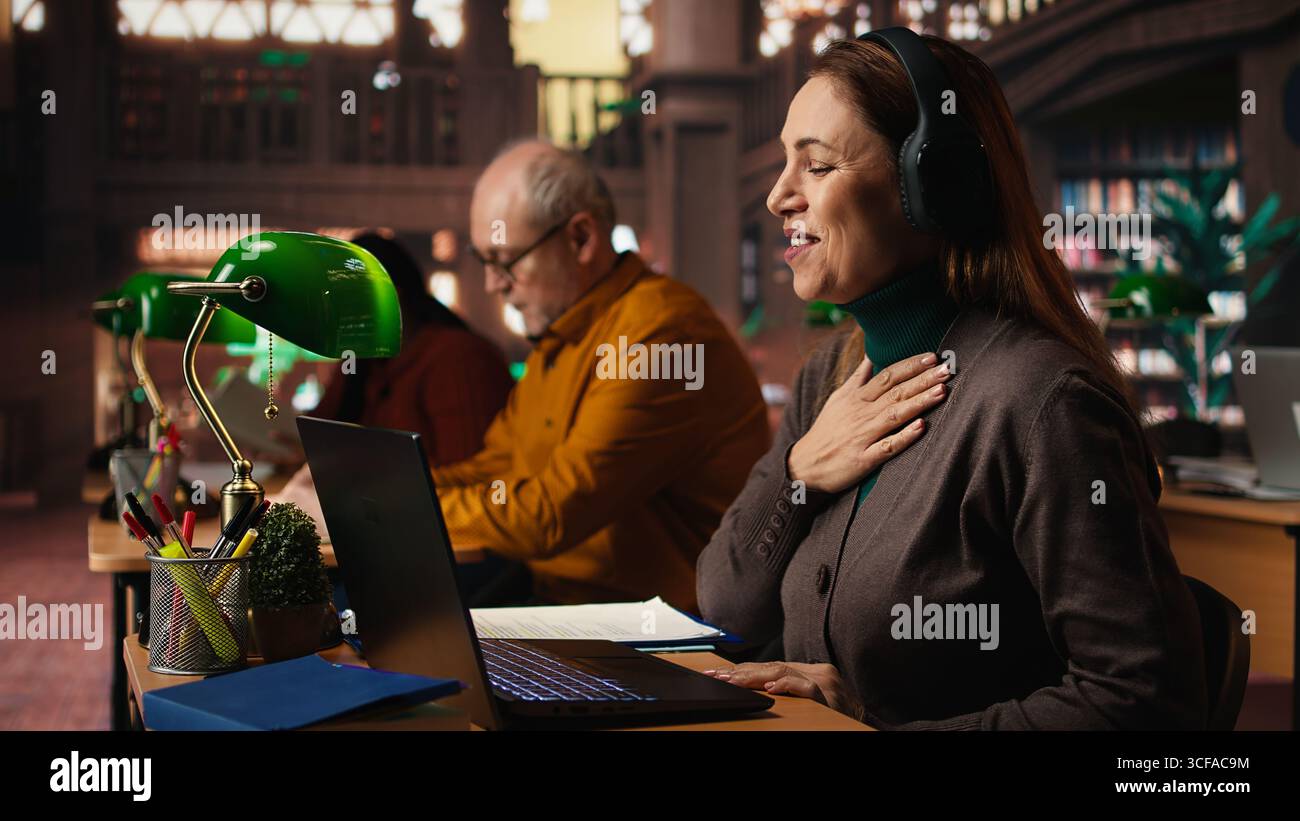 Mature woman listening groovy hi-res stock photography and images - Alamy