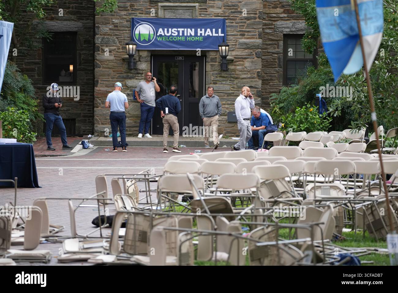 People use there phones in a mess of toppled chairs at the Villanova ...