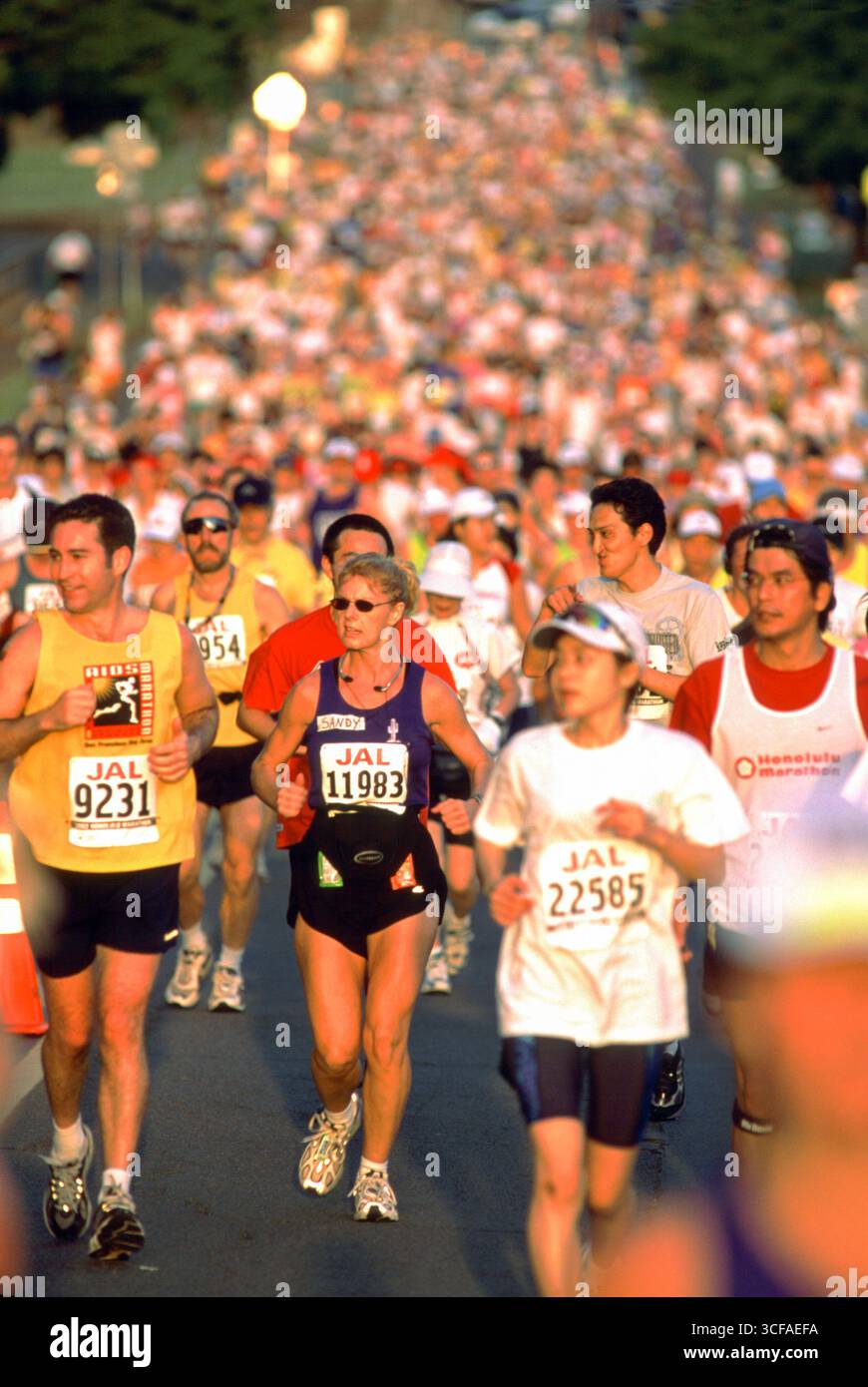 Crowds of people running in the 2002 Honolulu Marathon, Honolulu, Oahu ...