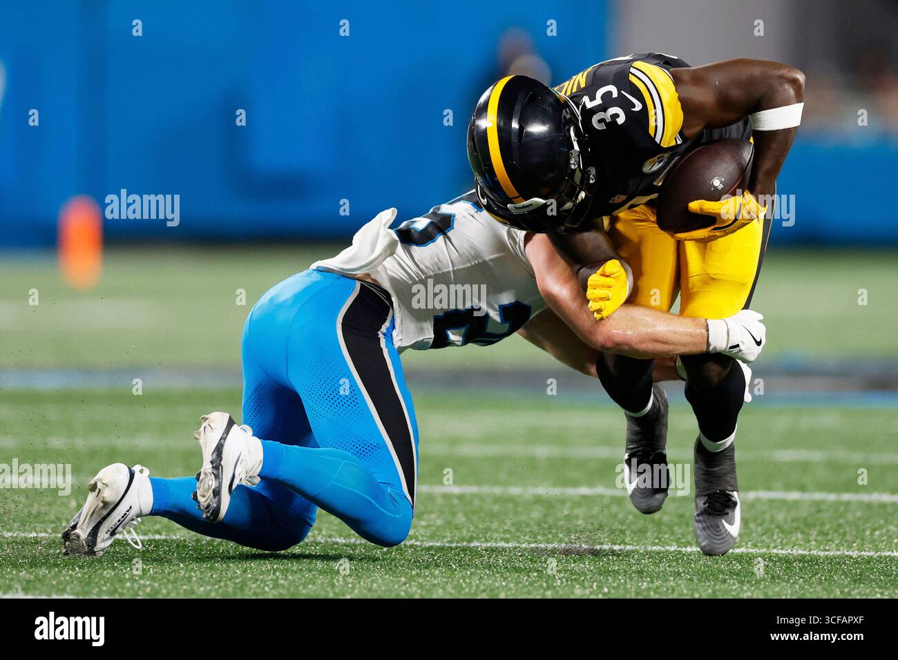 Pittsburgh Steelers running back Lew Nichols is tackled by Carolina ...