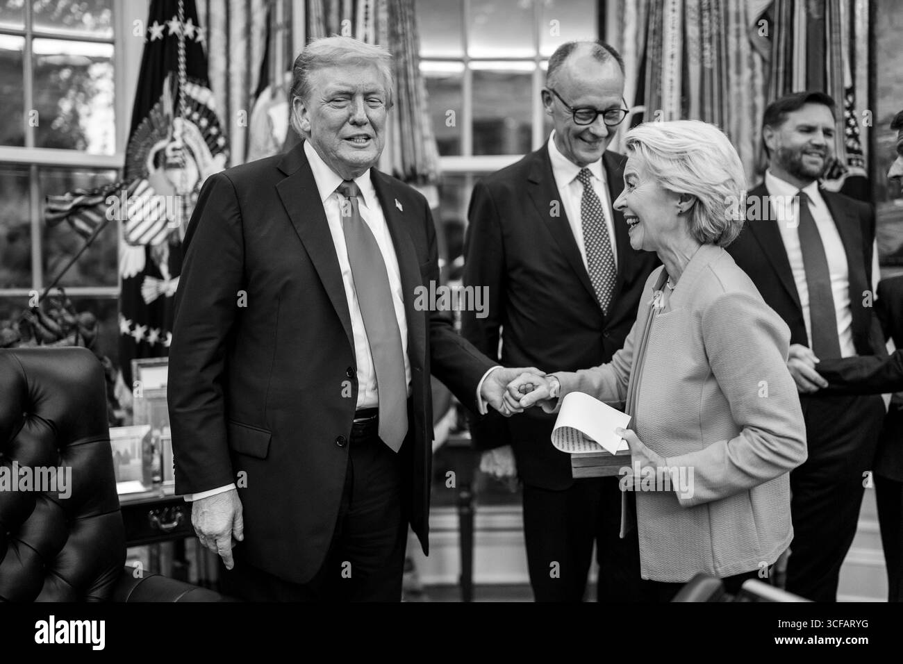 President Donald Trump shakes hands with European Commission President ...
