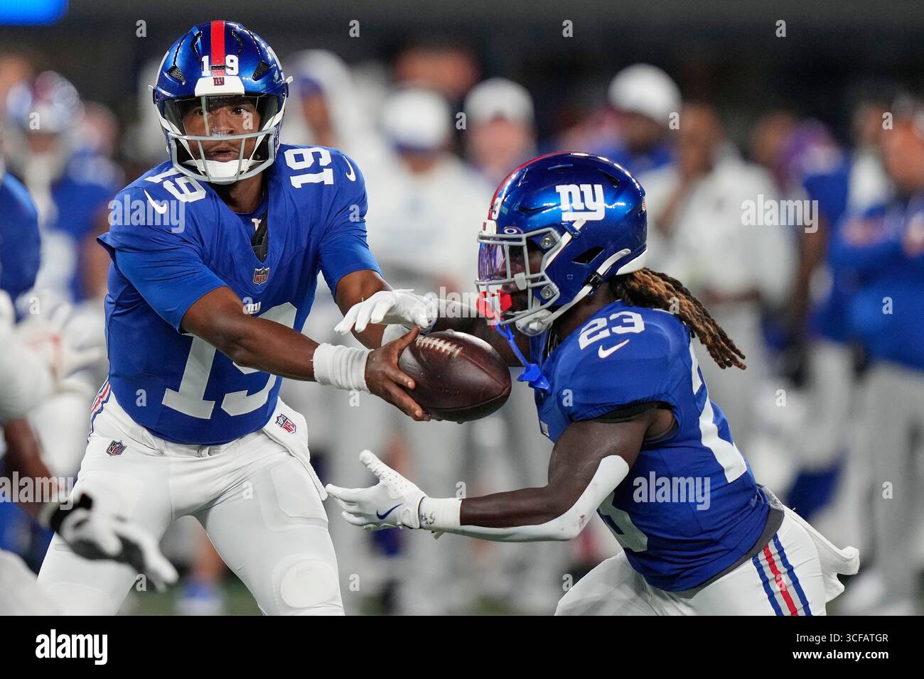 New York Giants quarterback Jameis Winston (19) hands off the ball to ...