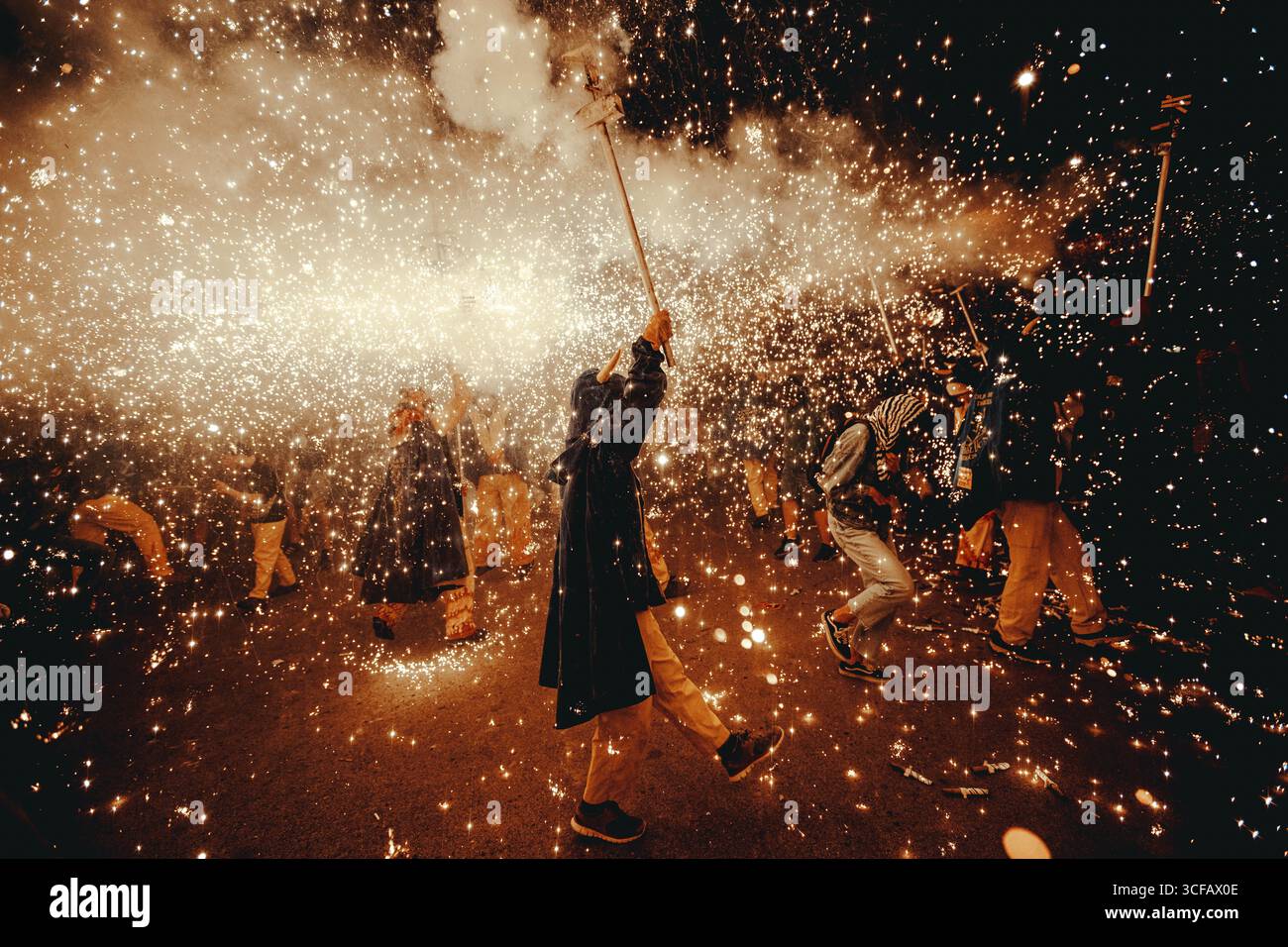 Barcelona, Spain. 21 August, 2025: Fire runners in devil costumes ...